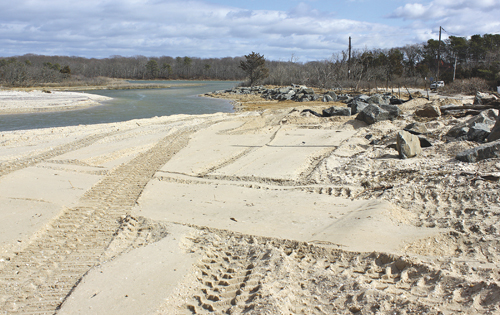 Rock revetment added to ease threat to road along Goldsmith Inlet - The ...