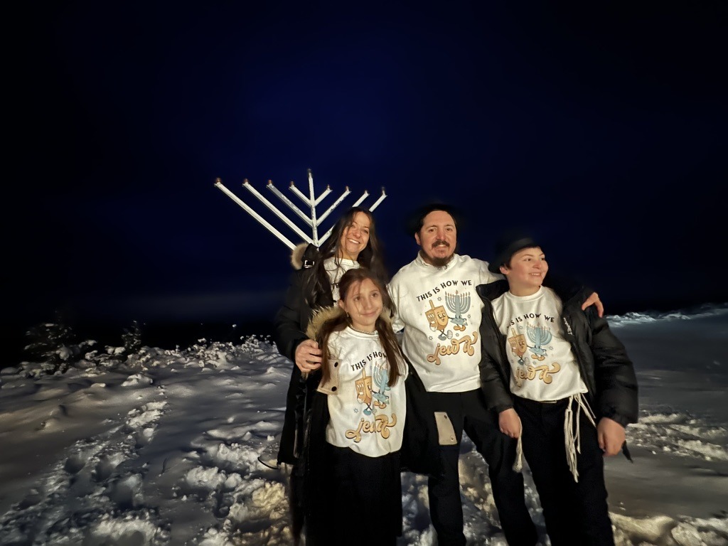North Fork rabbi lights menorah in defiance after friend killed in ...