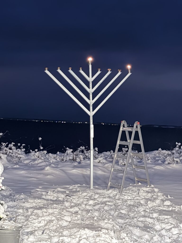 North Fork rabbi lights menorah in defiance after friend killed in ...