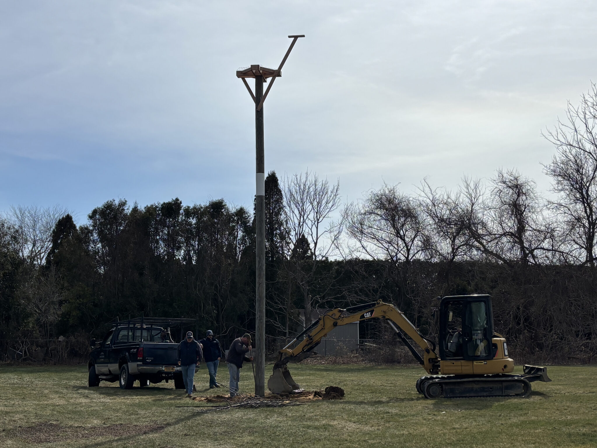 Southold High students install osprey pole as birds return - The ...